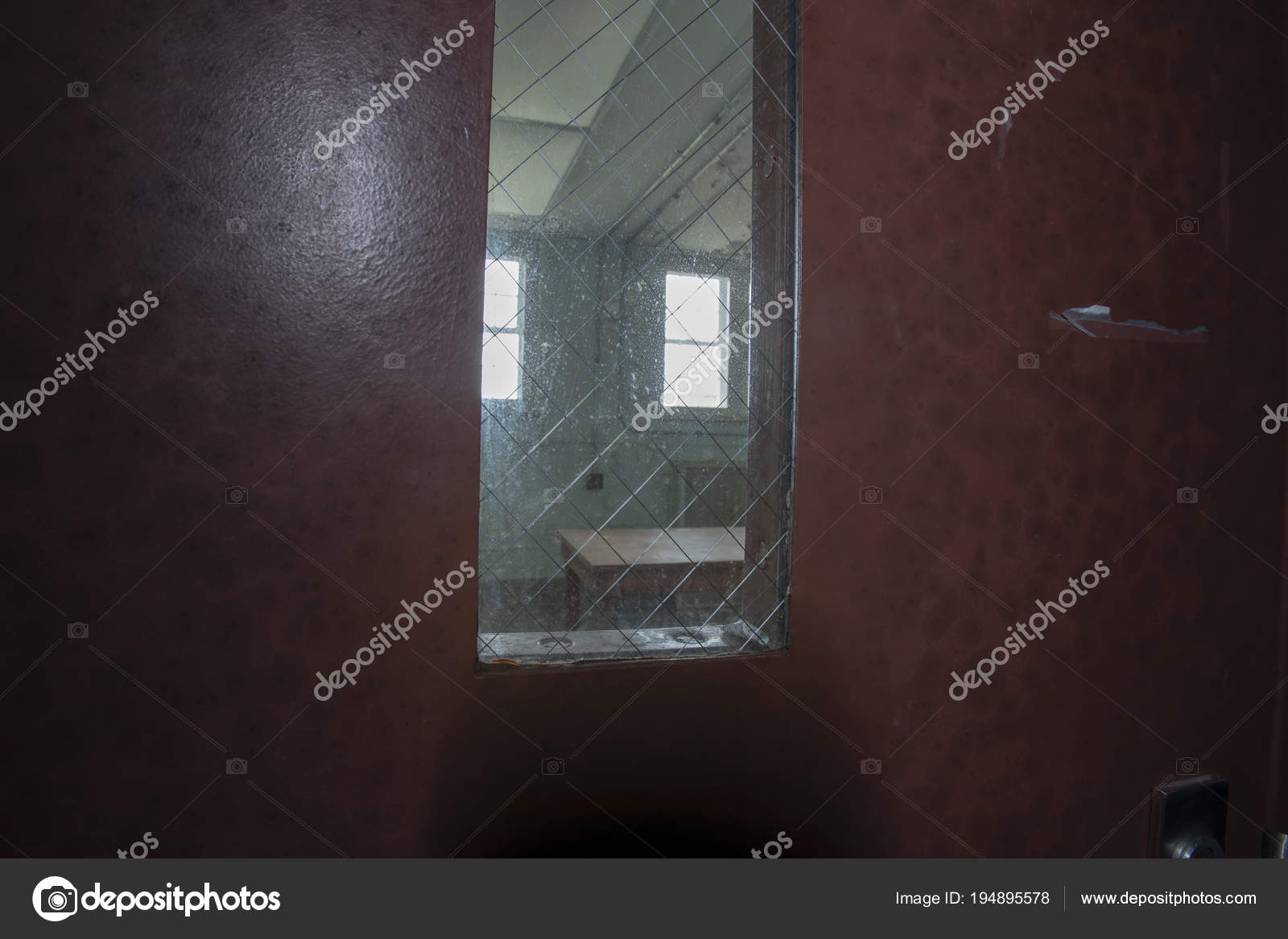 Table behind mesh windows in prison Stock Photo by ...