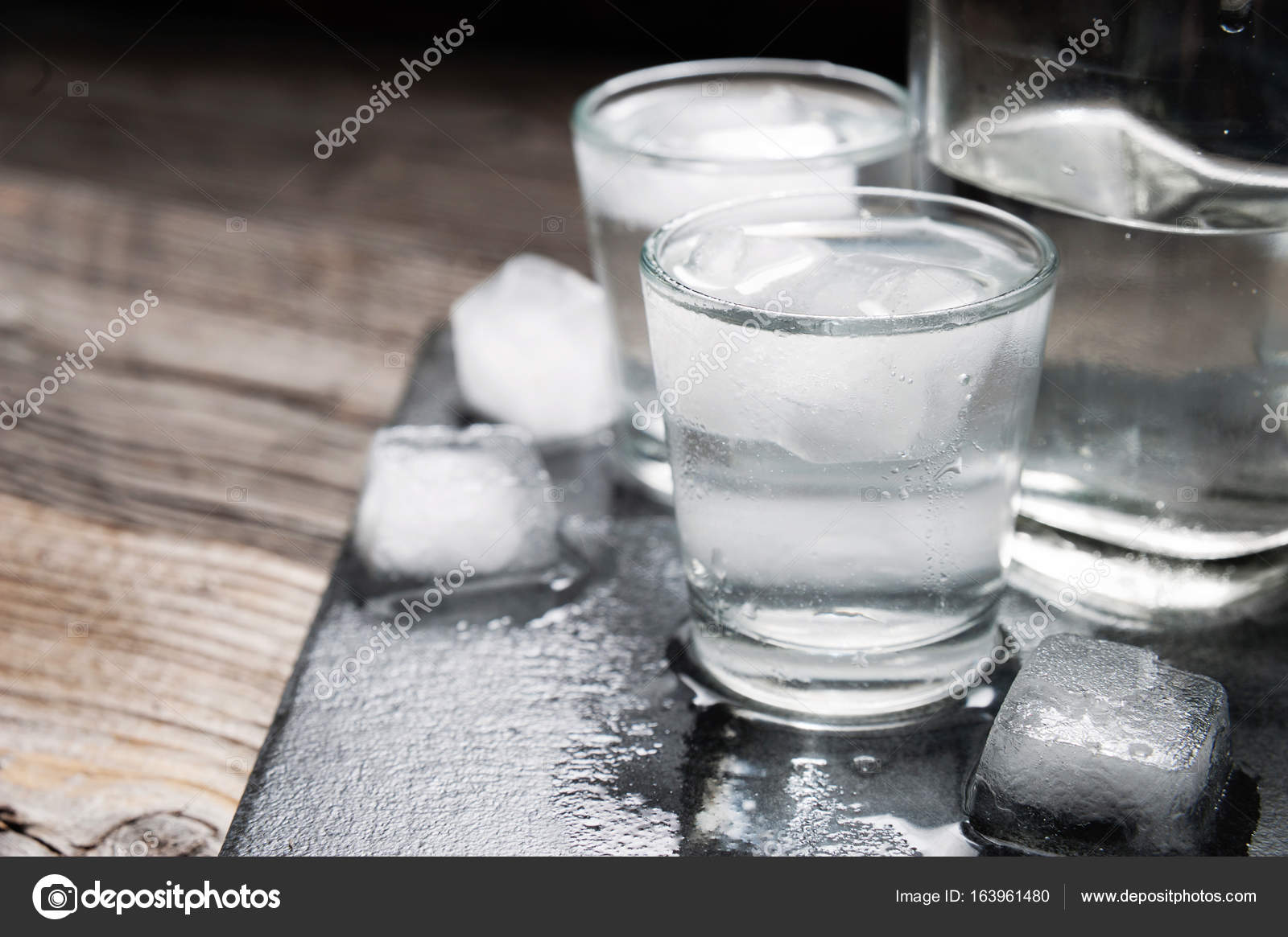 Vodka with ice in shot glasses Stock Photo by ©keira01 163961480