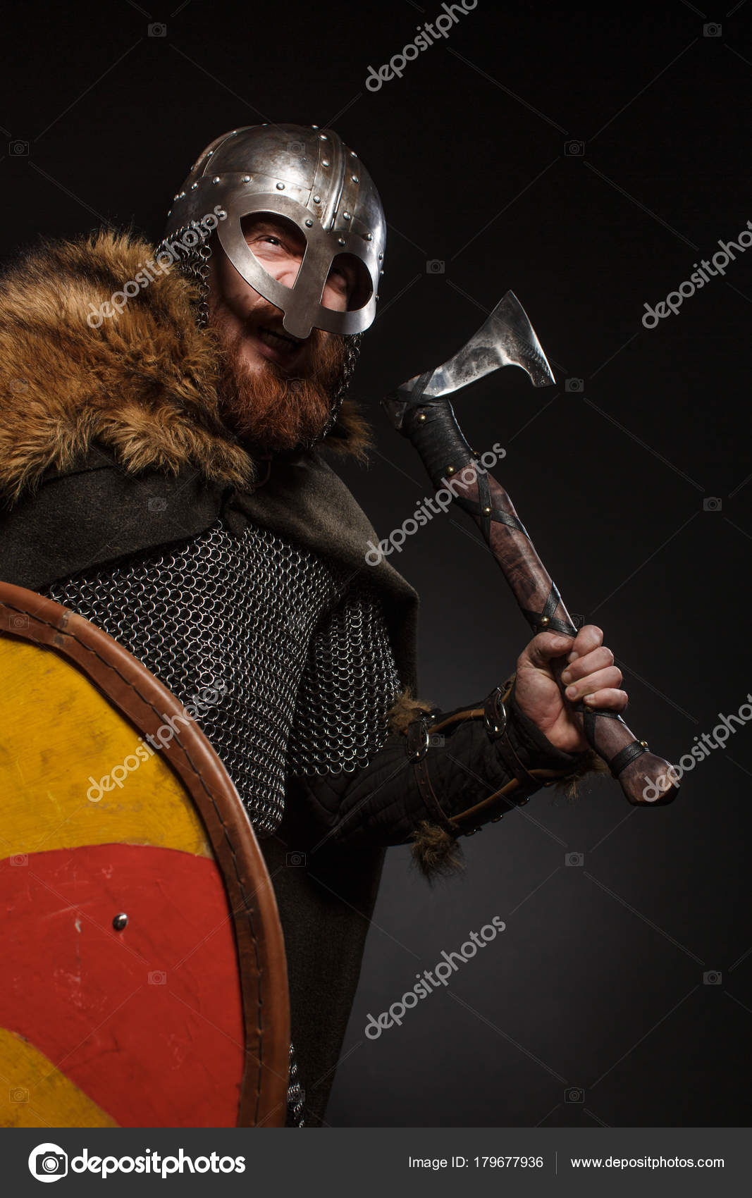 Warrior Viking in full arms with axe and shield on dark backgrou ...
