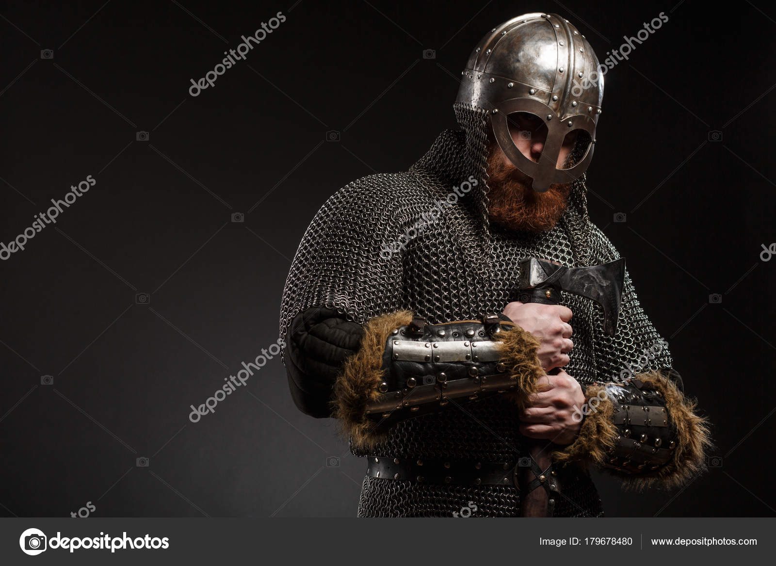 Warrior Viking in full arms with axe and helmet on dark backgrou ...