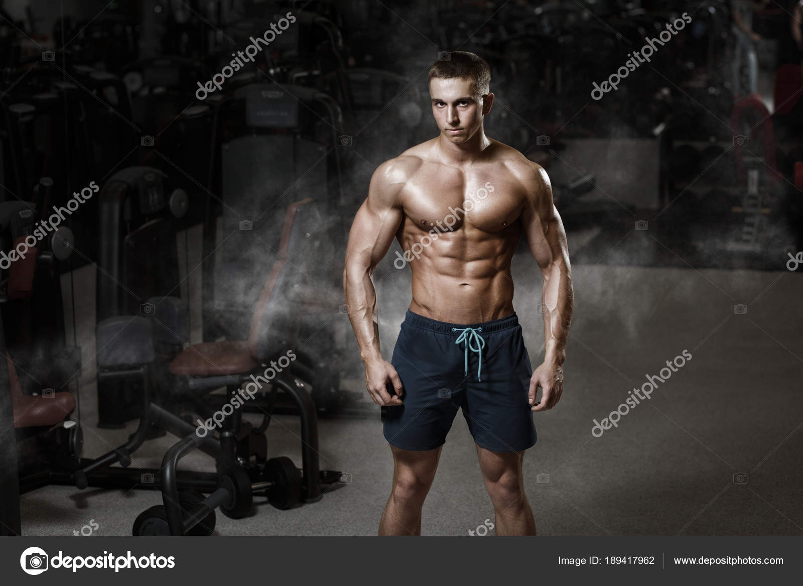Very power athletic guy standing, workout in gym — Stock Photo ...