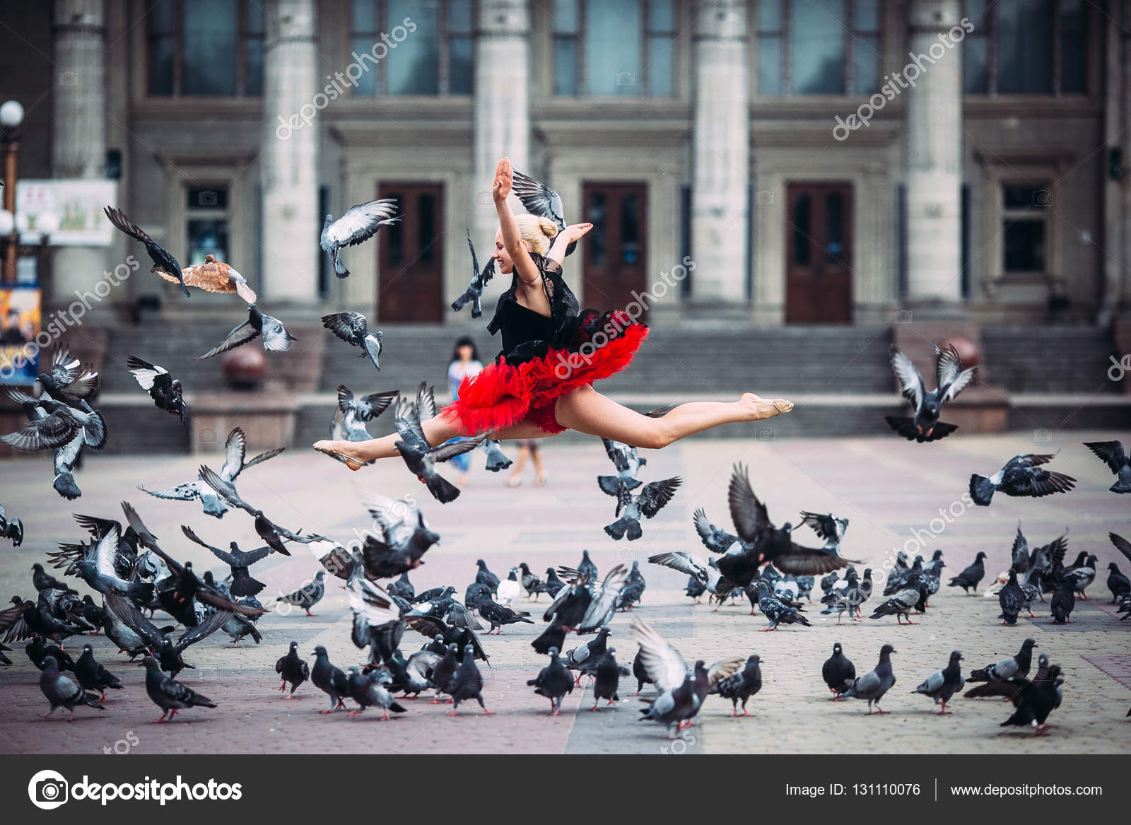 Ballerina doing splits in the air — Stock Photo © simbiothy #131110076
