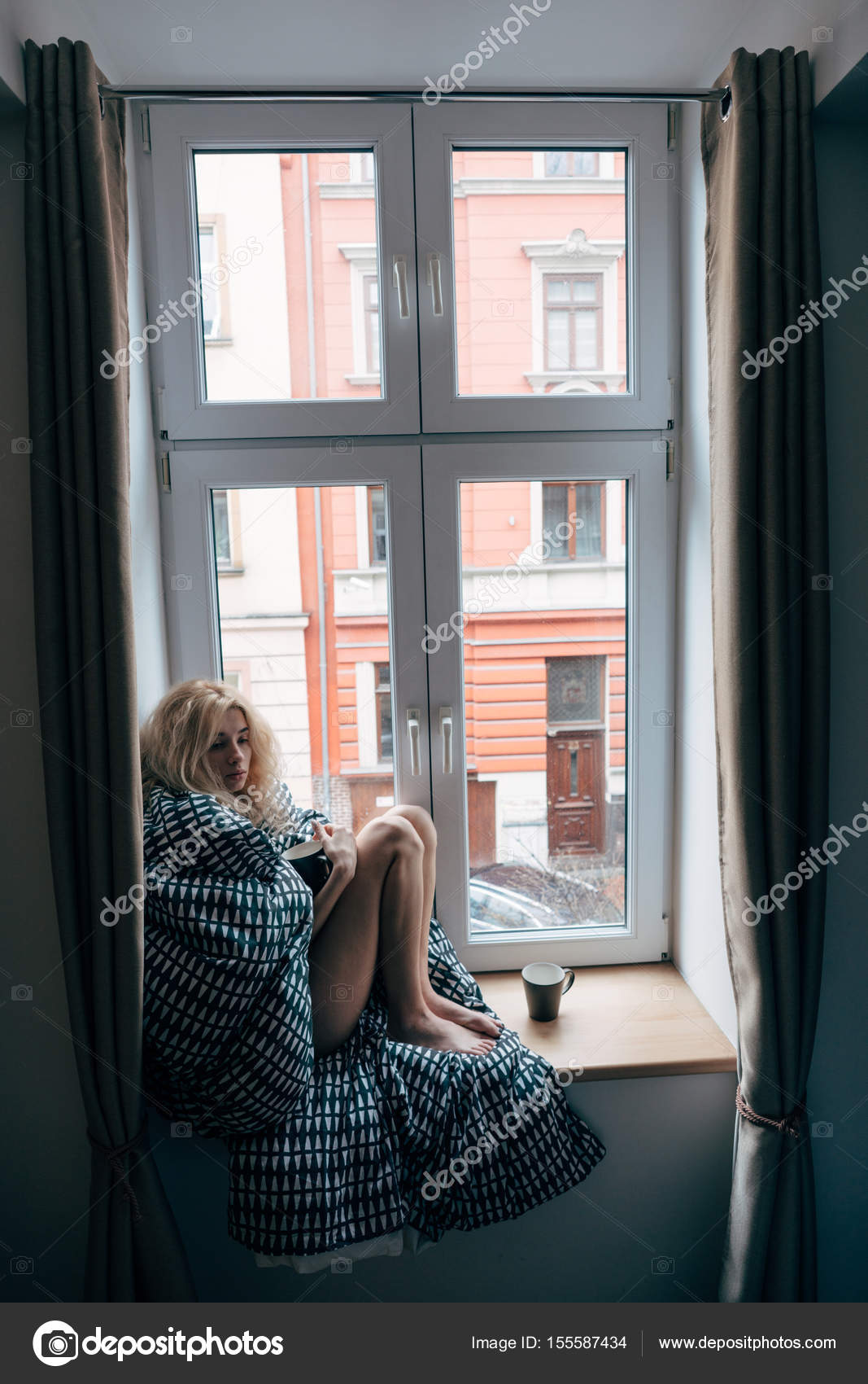 Girl sitting on a window Stock Photo by ©simbiothy 155587434