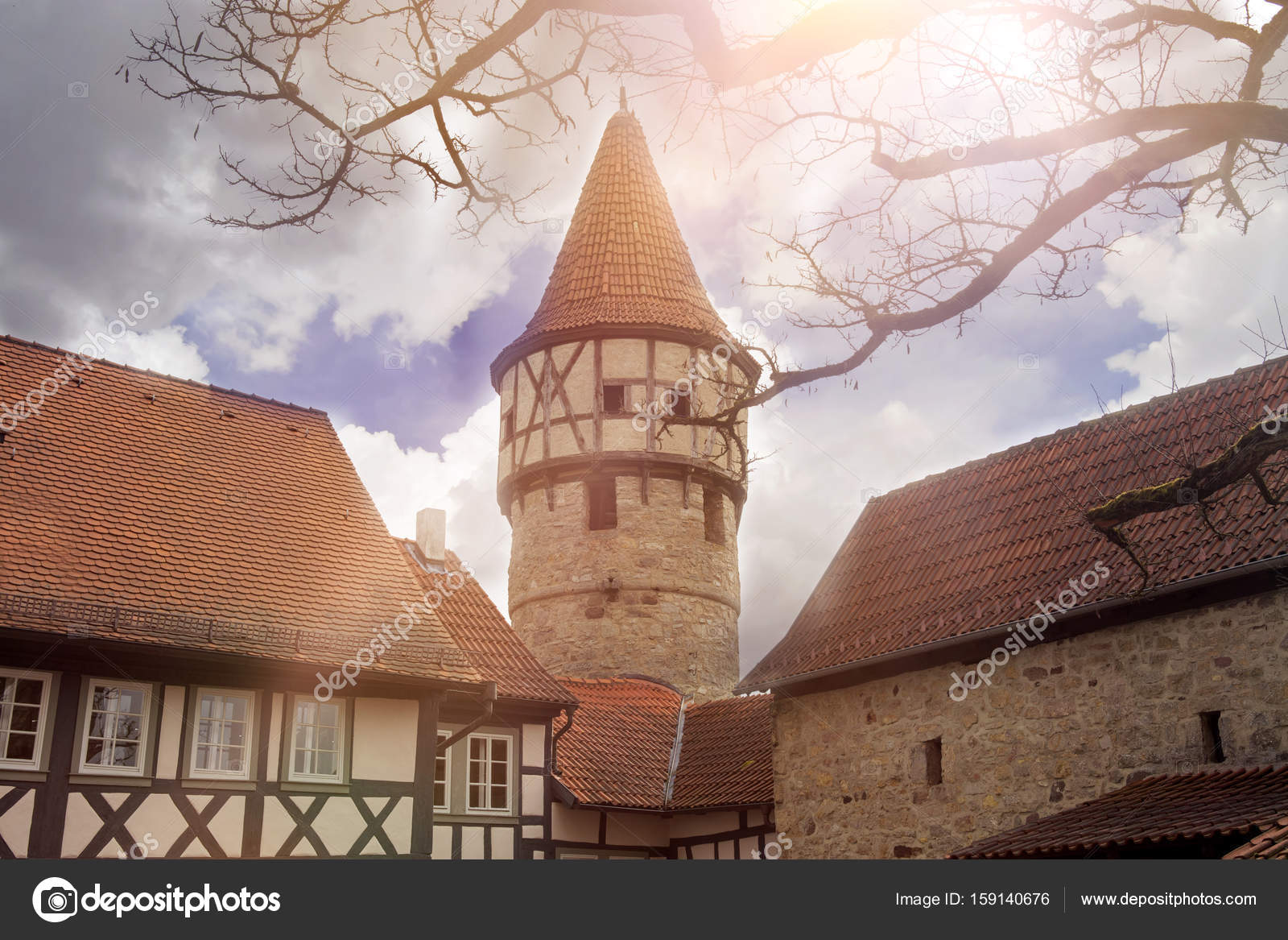 Old medieval tower and houses with red roofs Stock Photo by ...