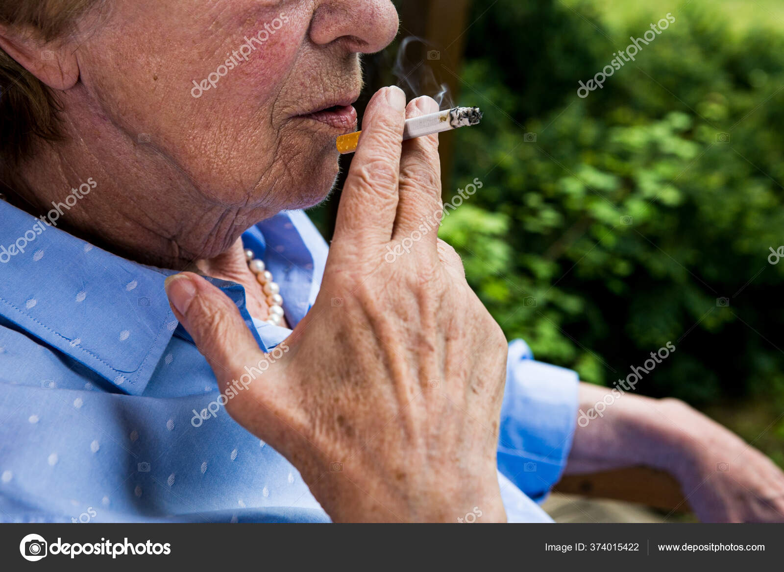 Old Woman Smoking Cigarette