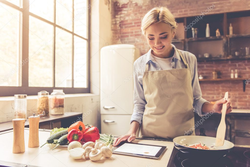 Beautiful girl cooking Stock Photo by ©vadimphoto1@gmail.com 128736748
