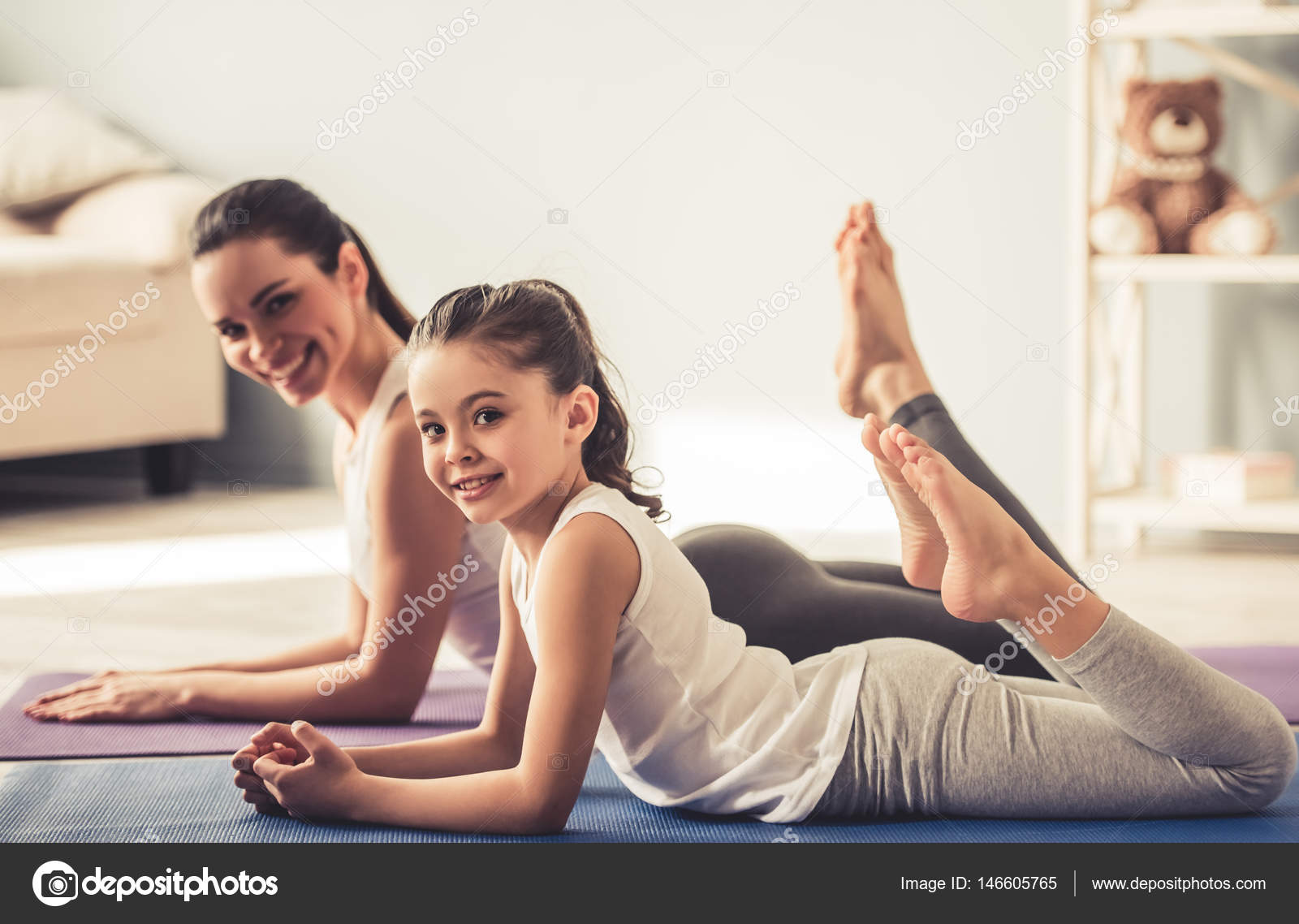Mom and daughter doing yoga — Stock Photo © vadimphoto1@gmail.com #146605765