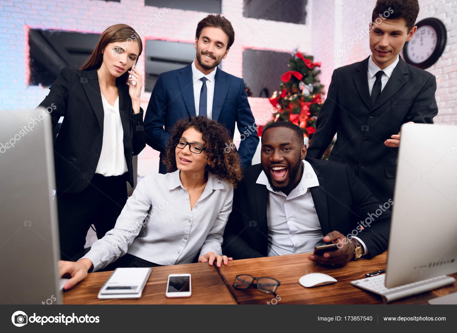 People work in the office in the new year. They are looking at the ...