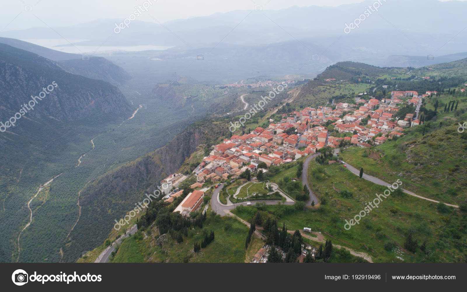 Aerial view of modern Delphi town, near archaeological site of ancient ...