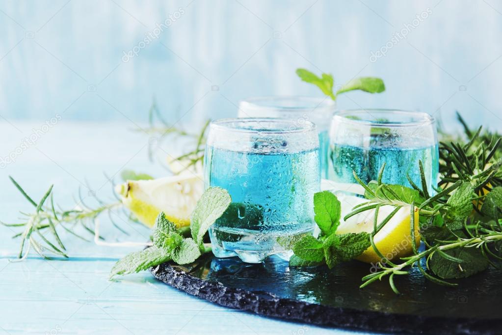 Blue curacao liqueur or sambuca with lemon Stock Photo by ©WildDrago ...