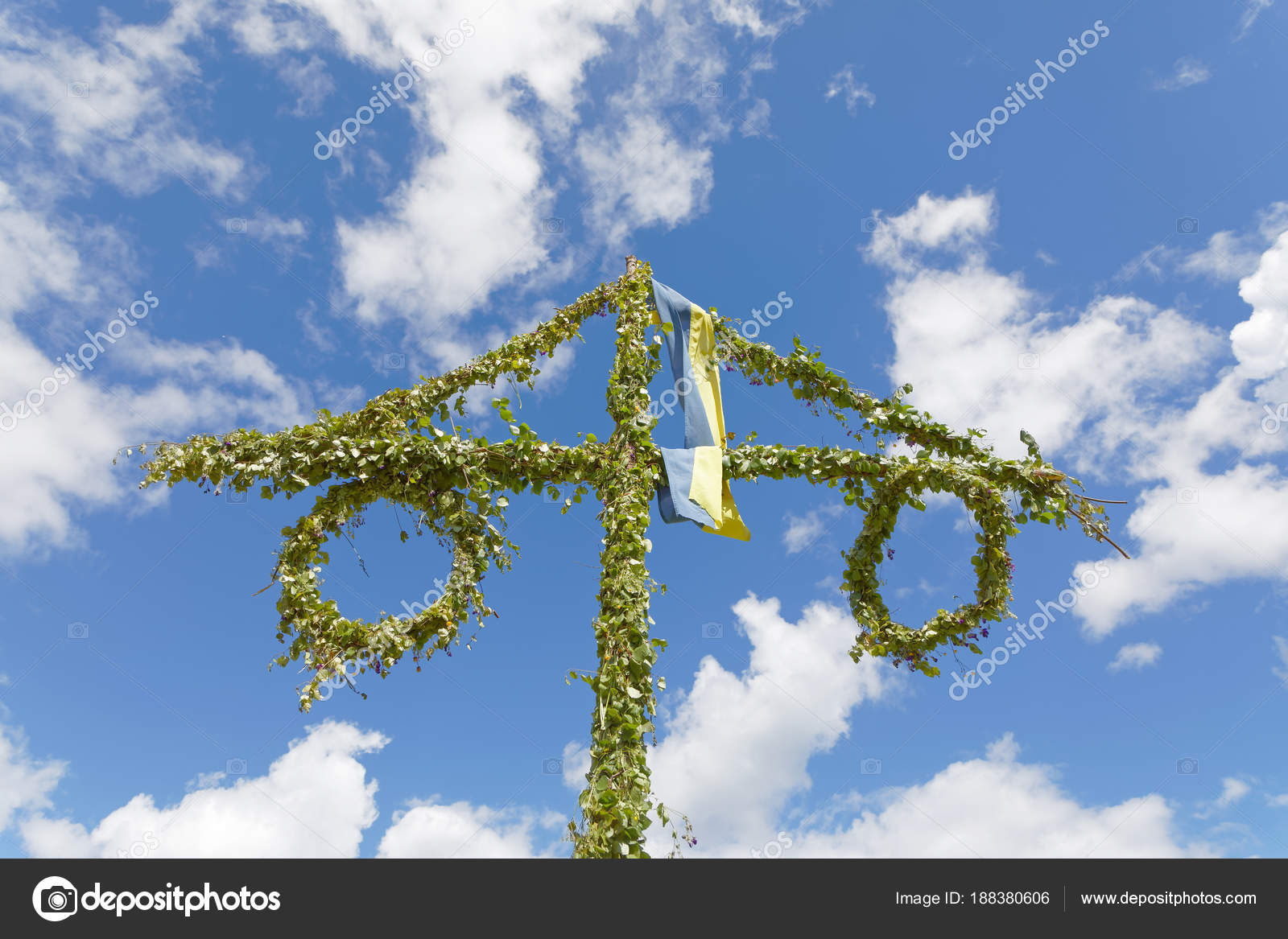 Maypole made of green leaf and the blue sky and some white cloud Stock ...