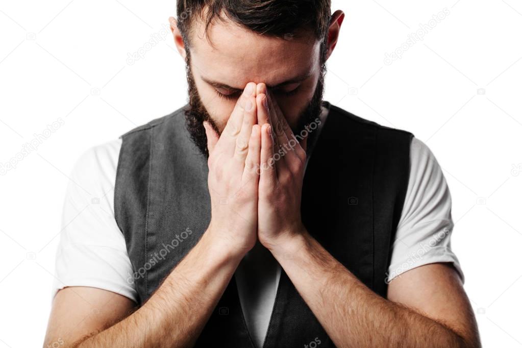 Young man praying over grey background Stock Photo by ©4masik 129938188