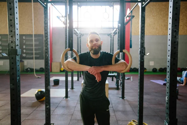 Athlete man with a beard exercising in a crossfit gym Stock Photo by ...