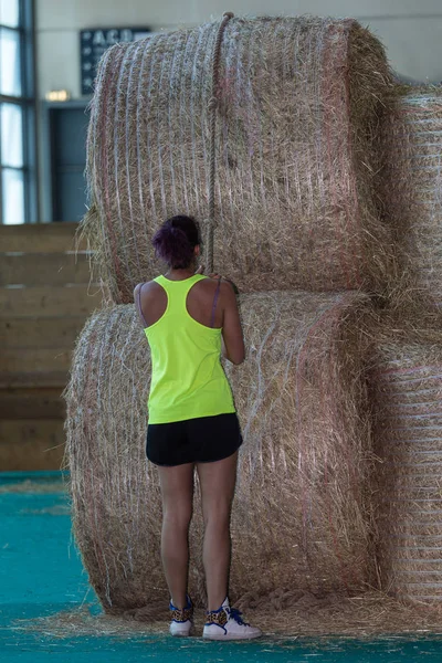 Indoor Hay Bale Obstacle Running Contest: People Climb Bale with Rope ...