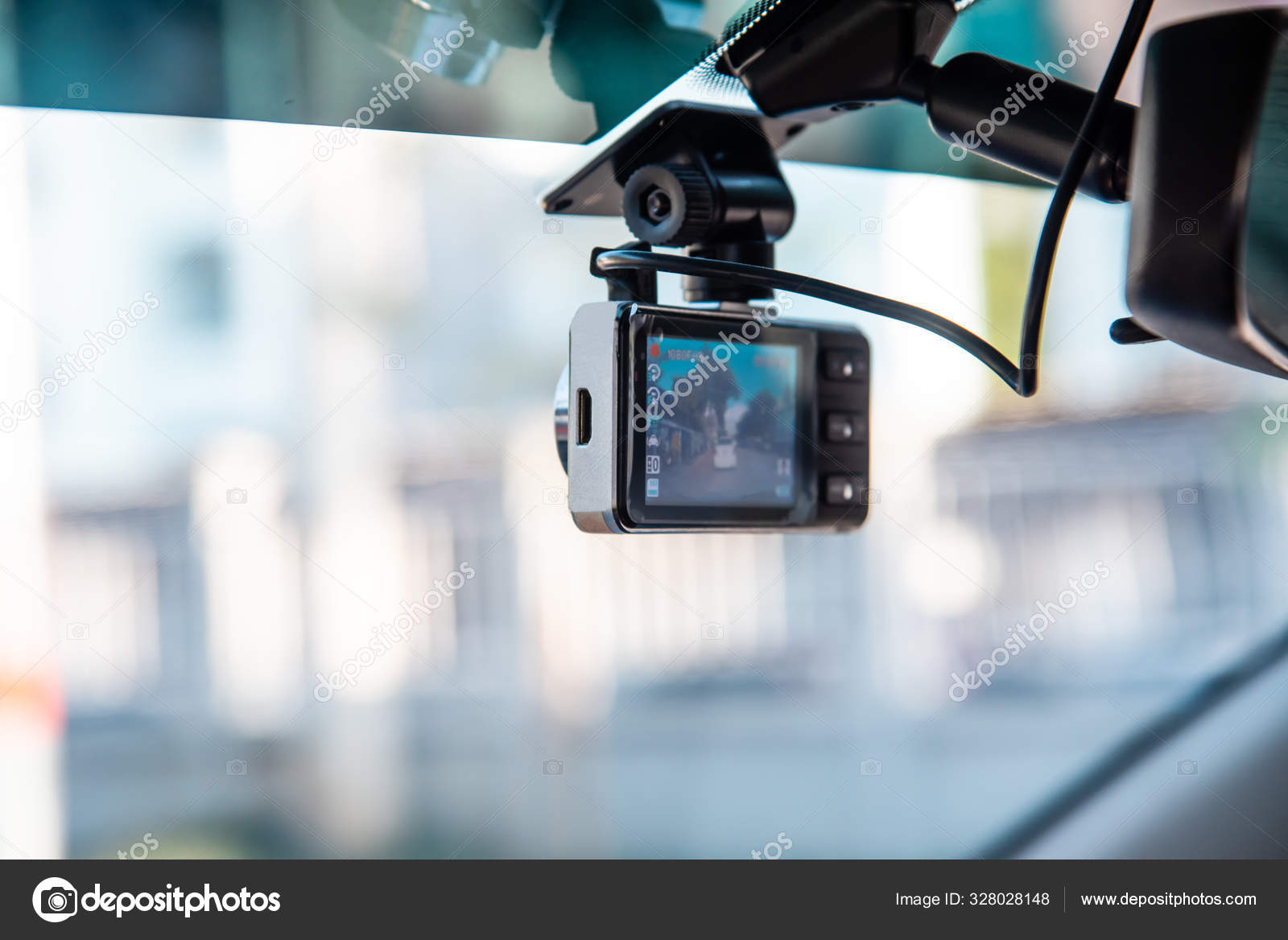 Car video camera attached to the windshield to record driving an ...