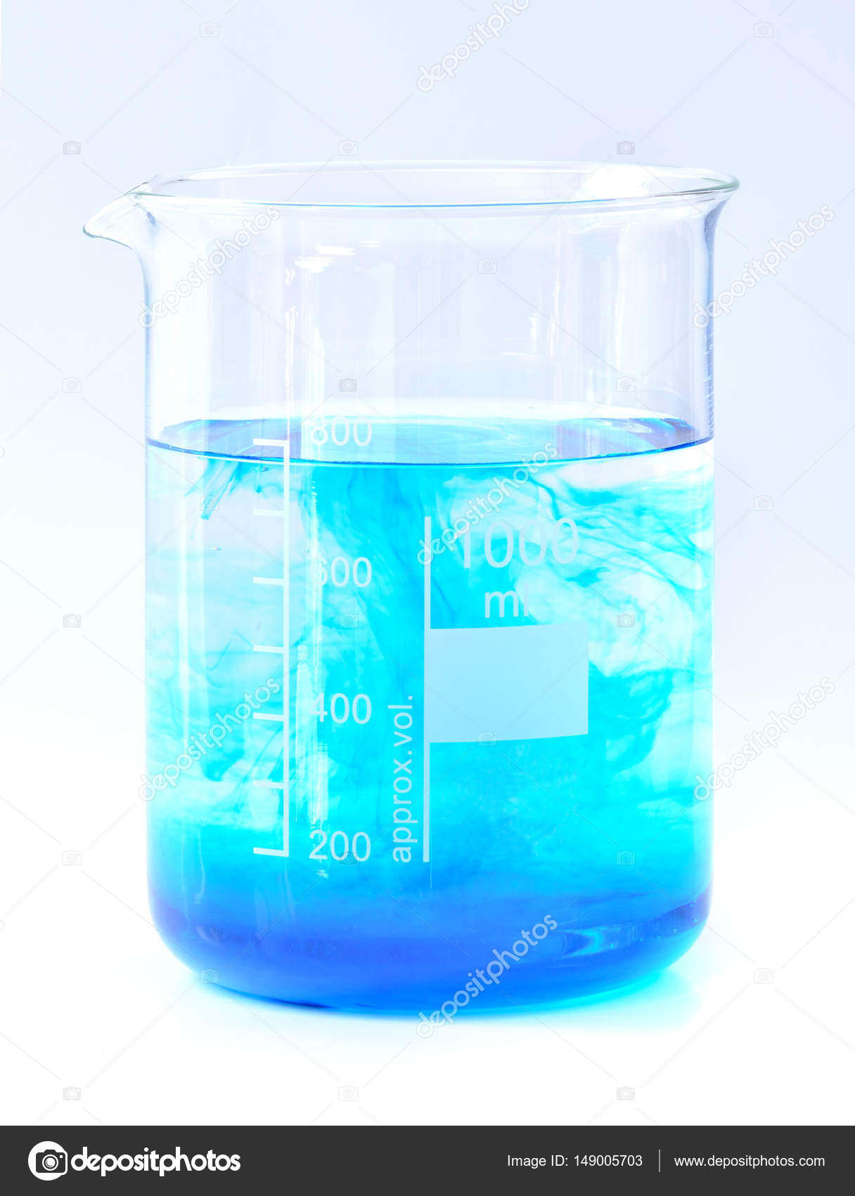 Dissolution process blue chemicals in water in beaker — Stock Photo ...