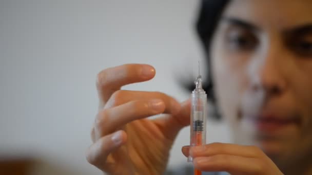 Closeup slow motion video of sick woman lying in bed and preparing ...