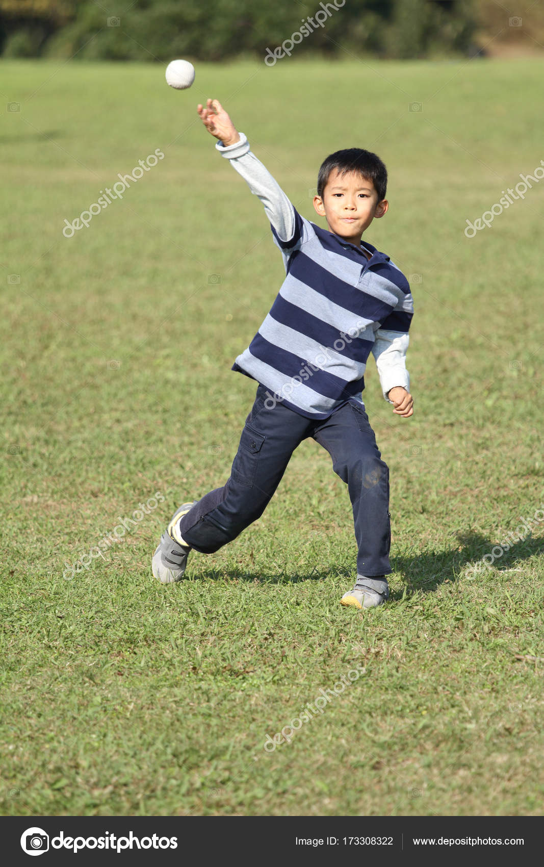 Japanese boy playing catch (second grade at elementary school) Stock ...