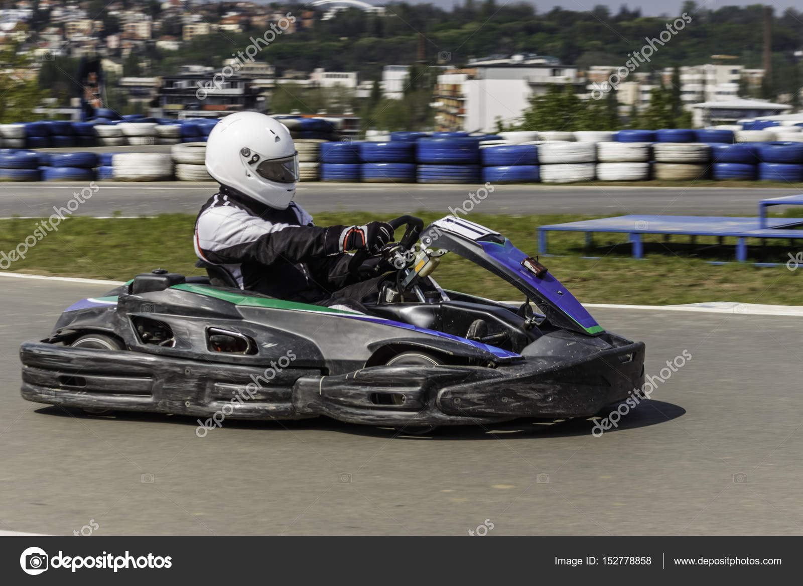 Karting Championship. Driver in karts wearing helmet, racing suit ...