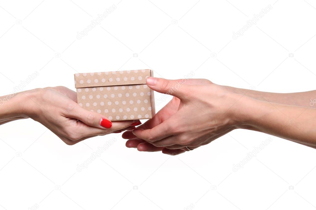 Hands giving and receiving a present gift isolated on white background ...