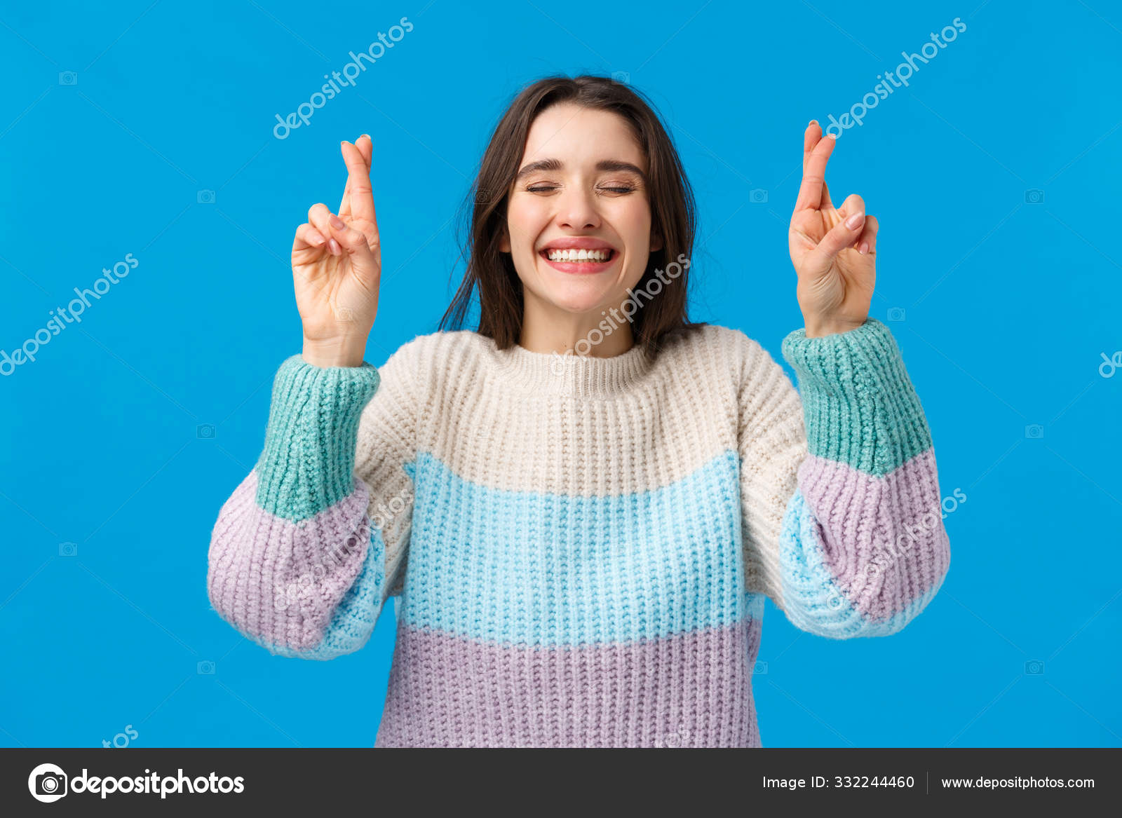 Optimistic cute feminine young girl in winter sweater, having faith ...