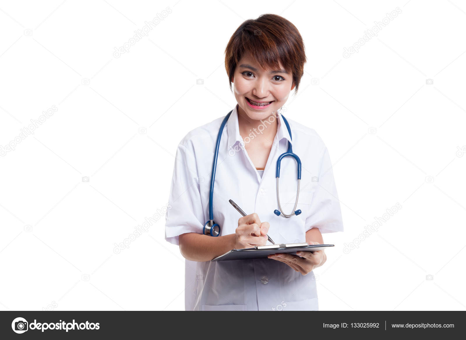 Asian young female doctor write on a clipboard. — Stock Photo ...
