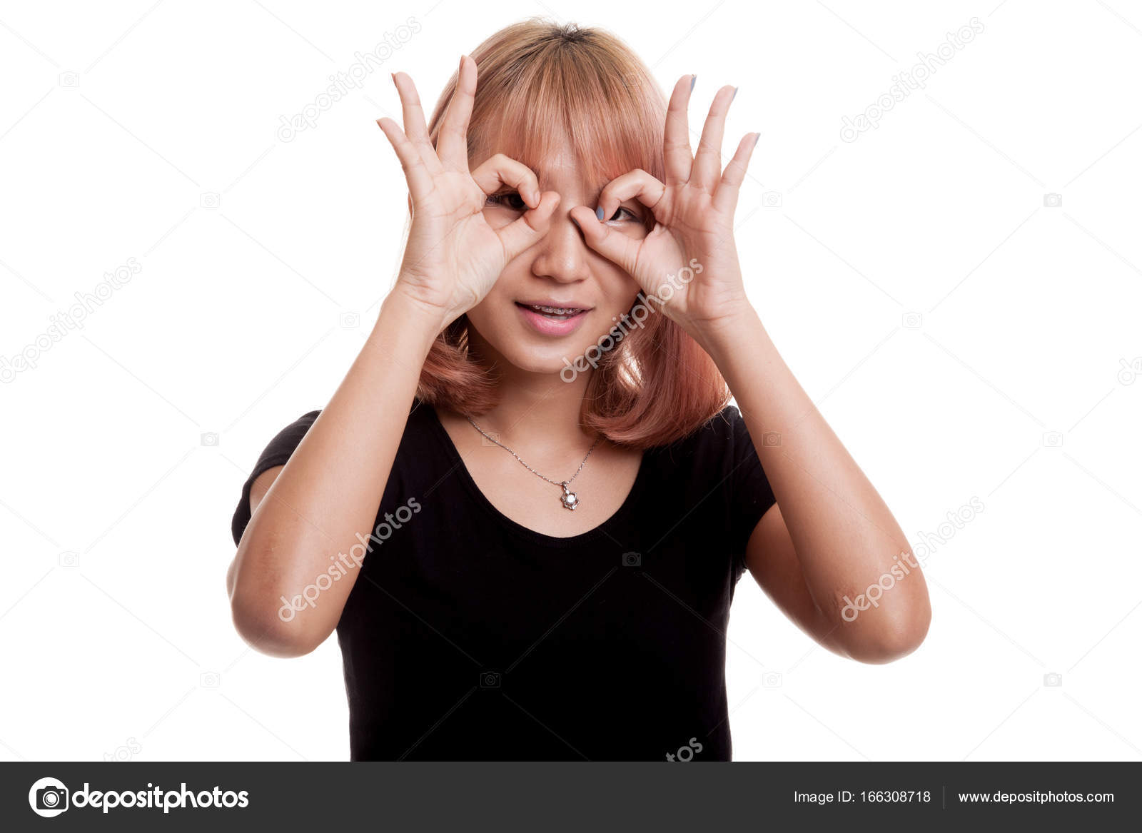 Asian woman do funny double OK sign as glasses. Stock Photo by ...