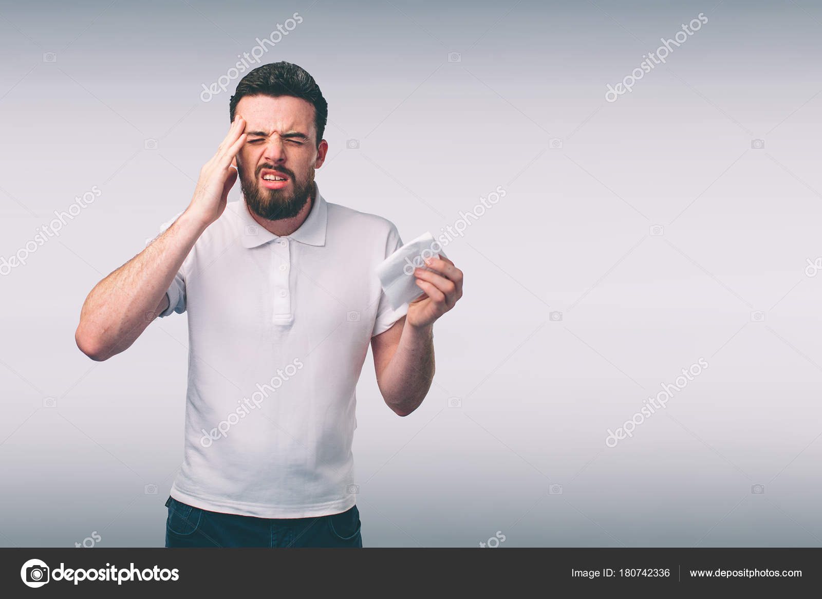 Studio picture from a young man with handkerchief. Sick guy isolated ...