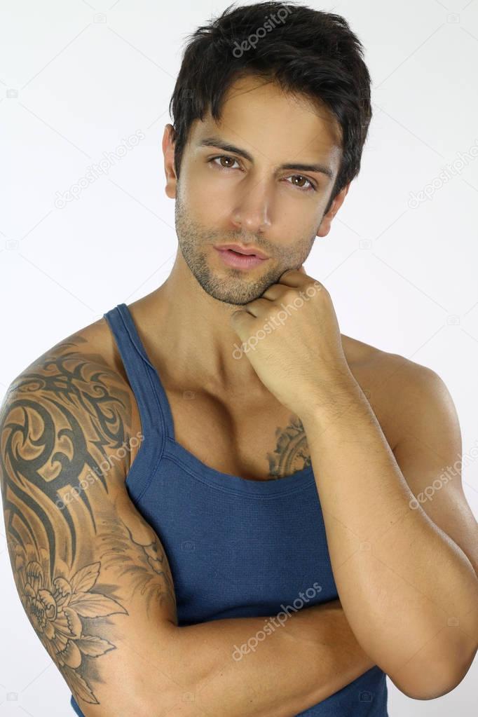 Handsome man wearing a blue tank top — Stock Photo © rdrgraphe #129241120