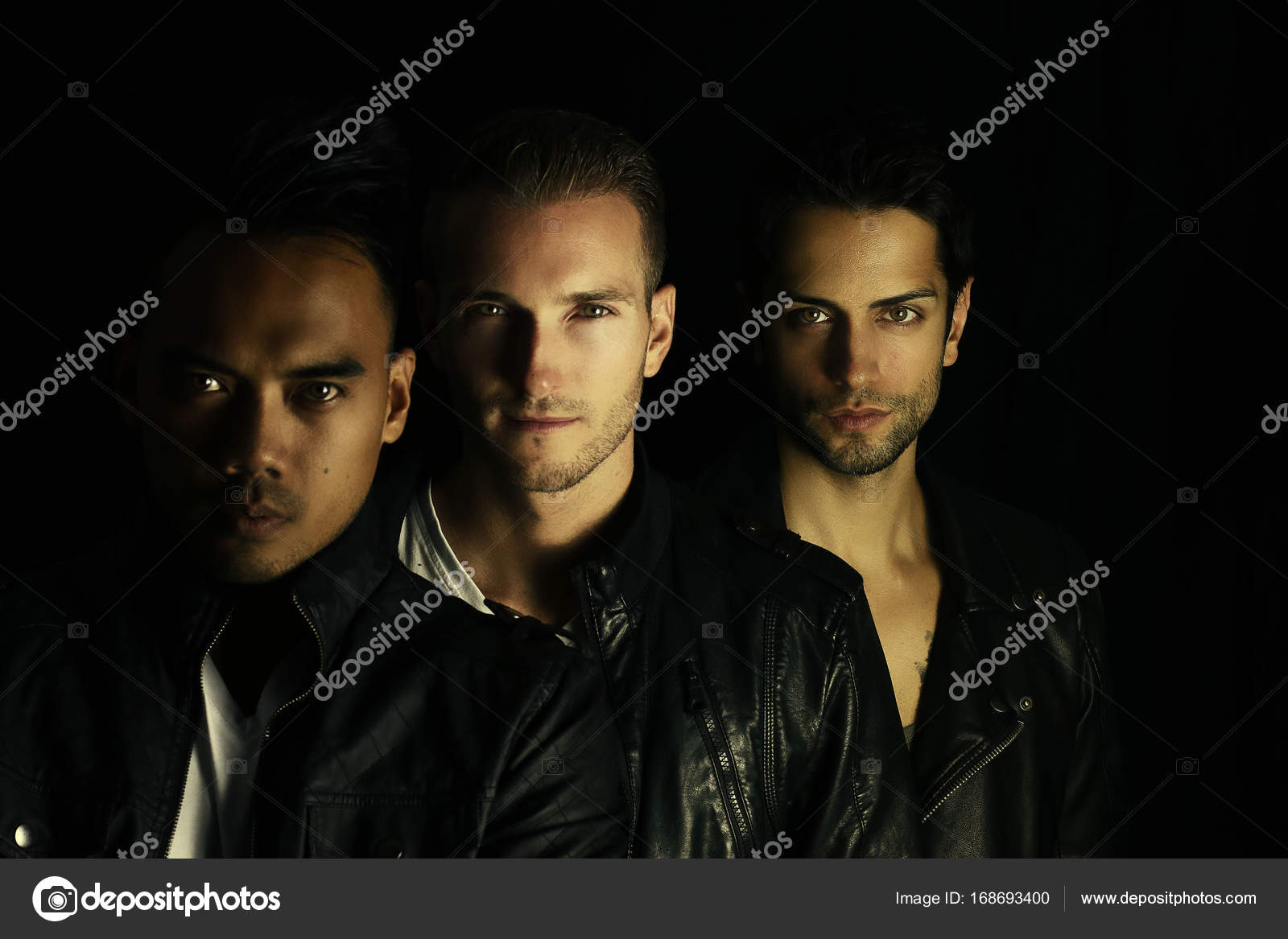 Three beautiful mysterious guys posing Stock Photo by ©rdrgraphe 168693400