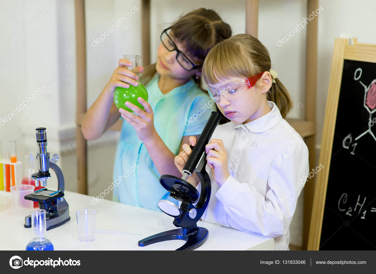 Kids making science experiments Stock Photo by ©Lenanichizhenova 131833046