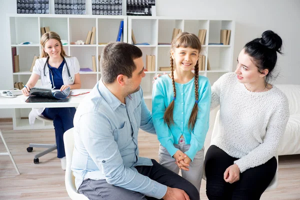 Happy family with doctor - Stock Image - Everypixel