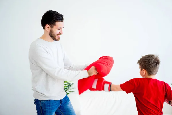 Father and son having boxing training — Stock Photo © belchonock #152168120