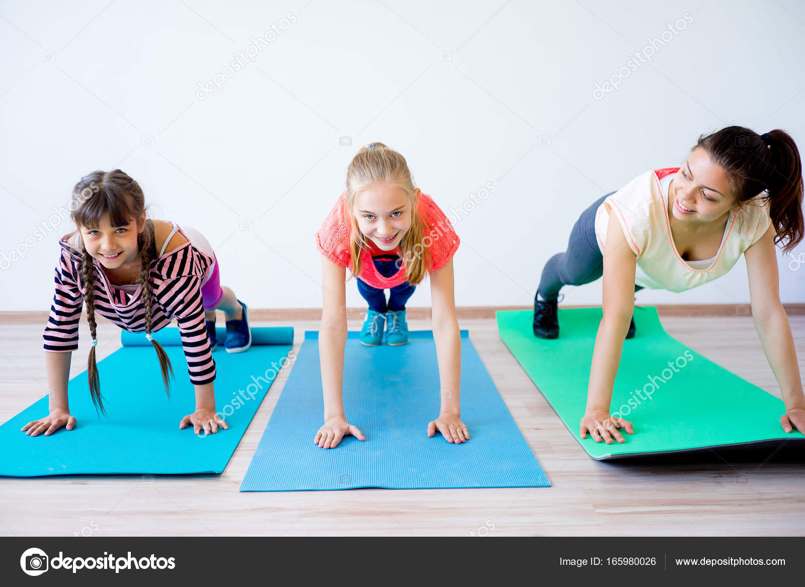 Girls in a gym Stock Photo by ©Lenanichizhenova 165980026