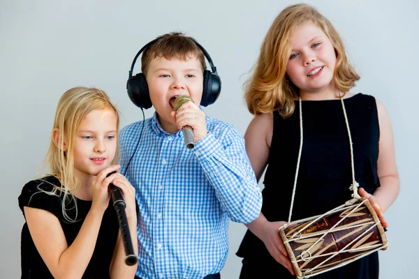 Kids group playing musical instruments in studio Stock Photos, Royalty ...