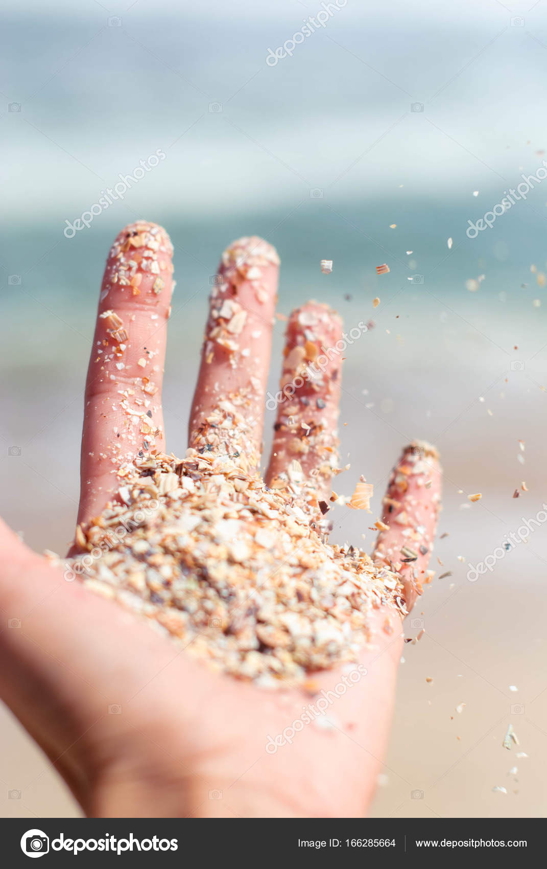 Female hand on the beach with sea sand for background. — Stock Photo ...