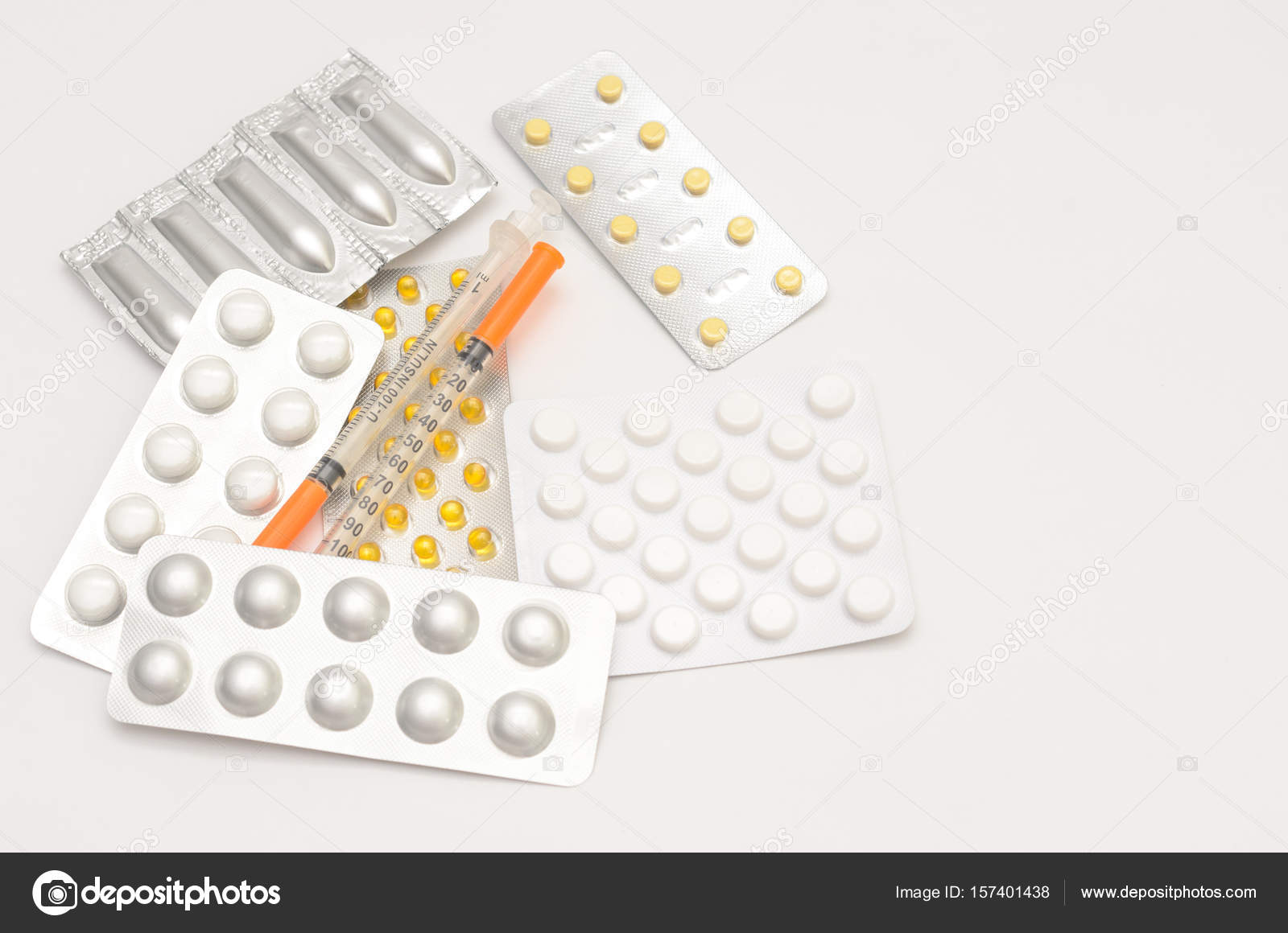 Contraceptive tablets in packages and without on a light background ...
