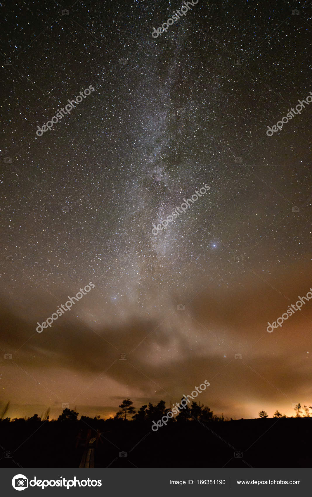 Colorful milky way galaxy seen in night sky over trees — Stock Photo ...
