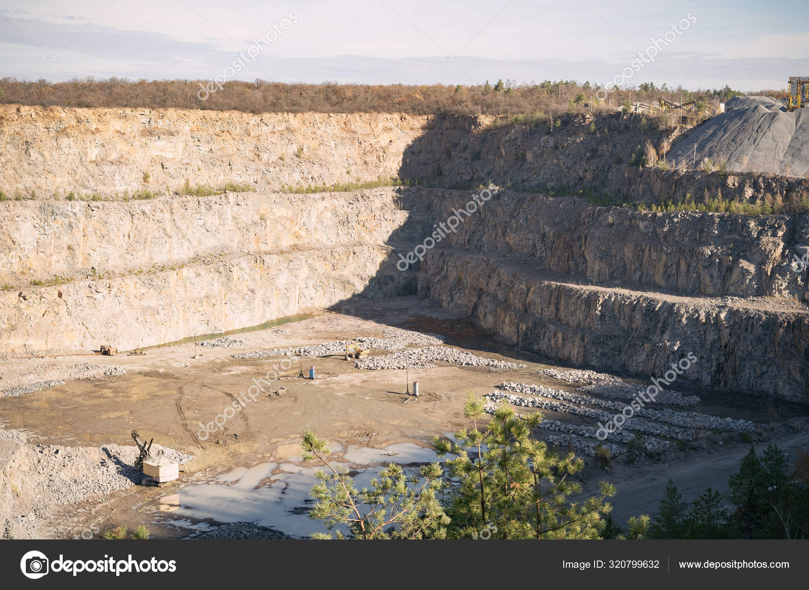 Excavator in a stone quarry for the extraction of crushed stone and ...