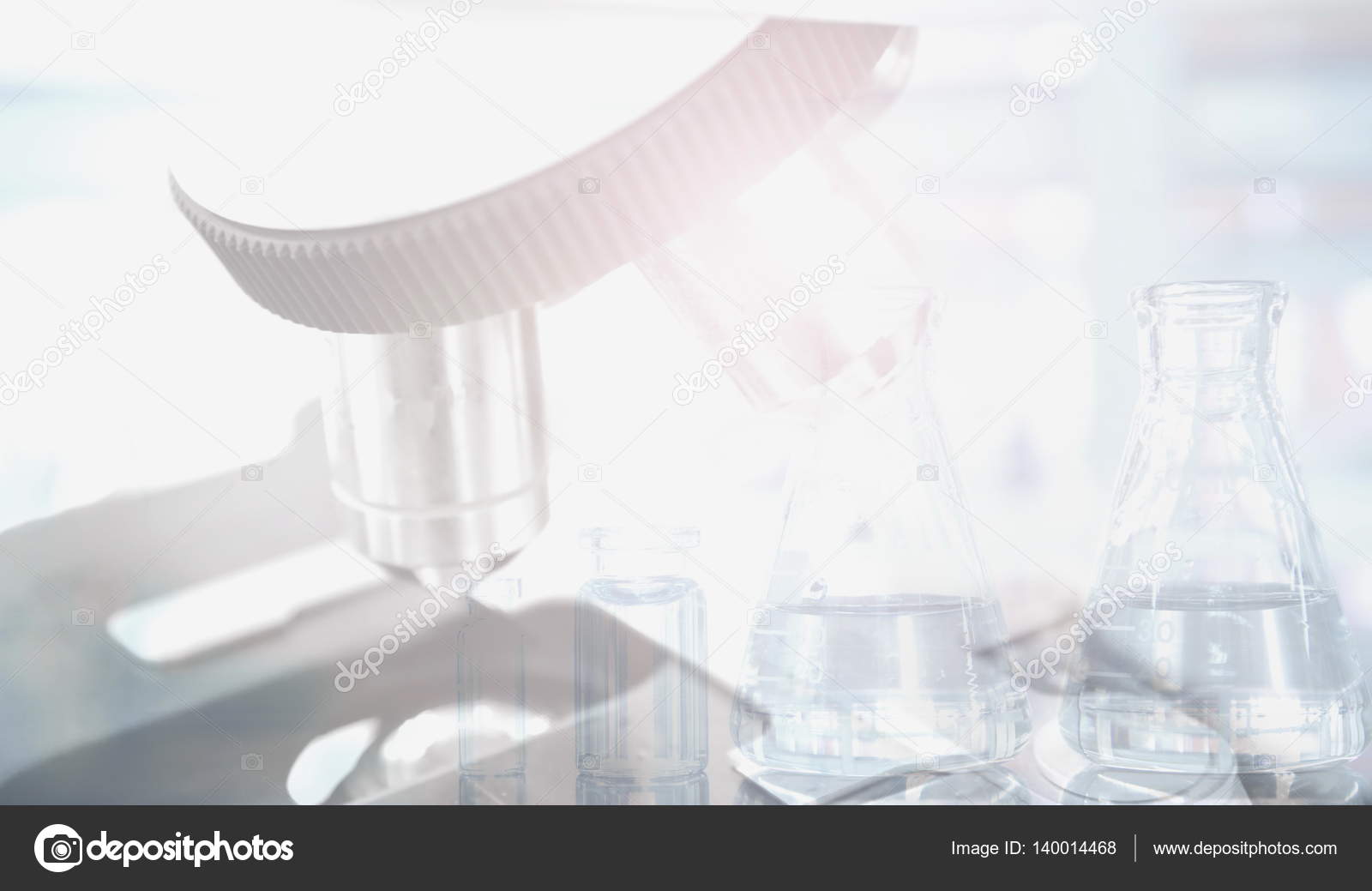 Blue flask with microscope background in science laboratory Stock Photo ...