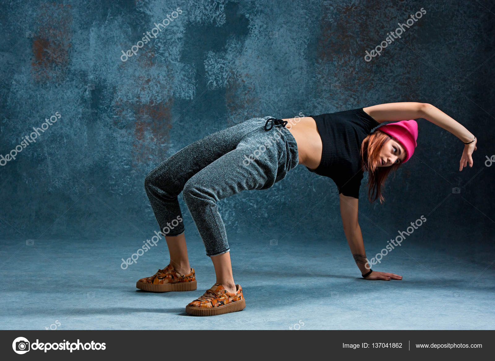 Young girl break dancing on wall background. Stock Photo by ©vova130555 ...