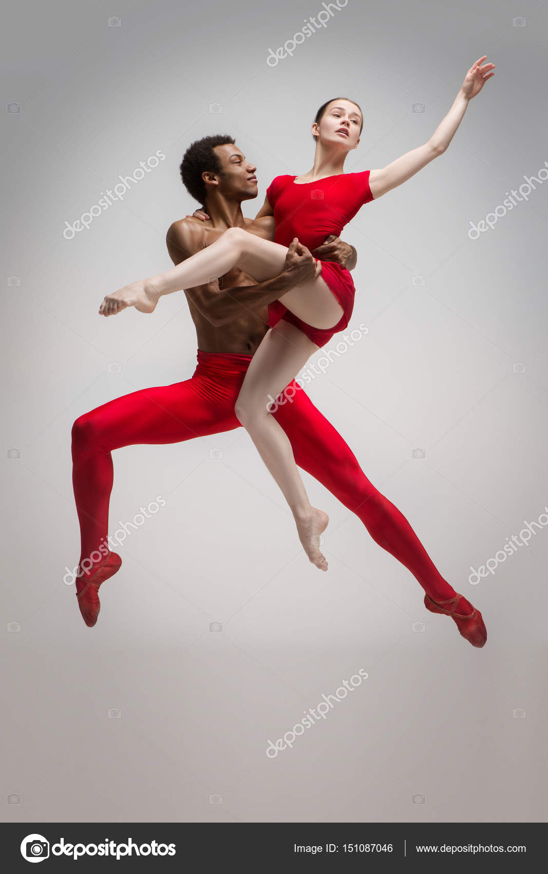 Couple of ballet dancers posing over gray background Stock Photo by ...