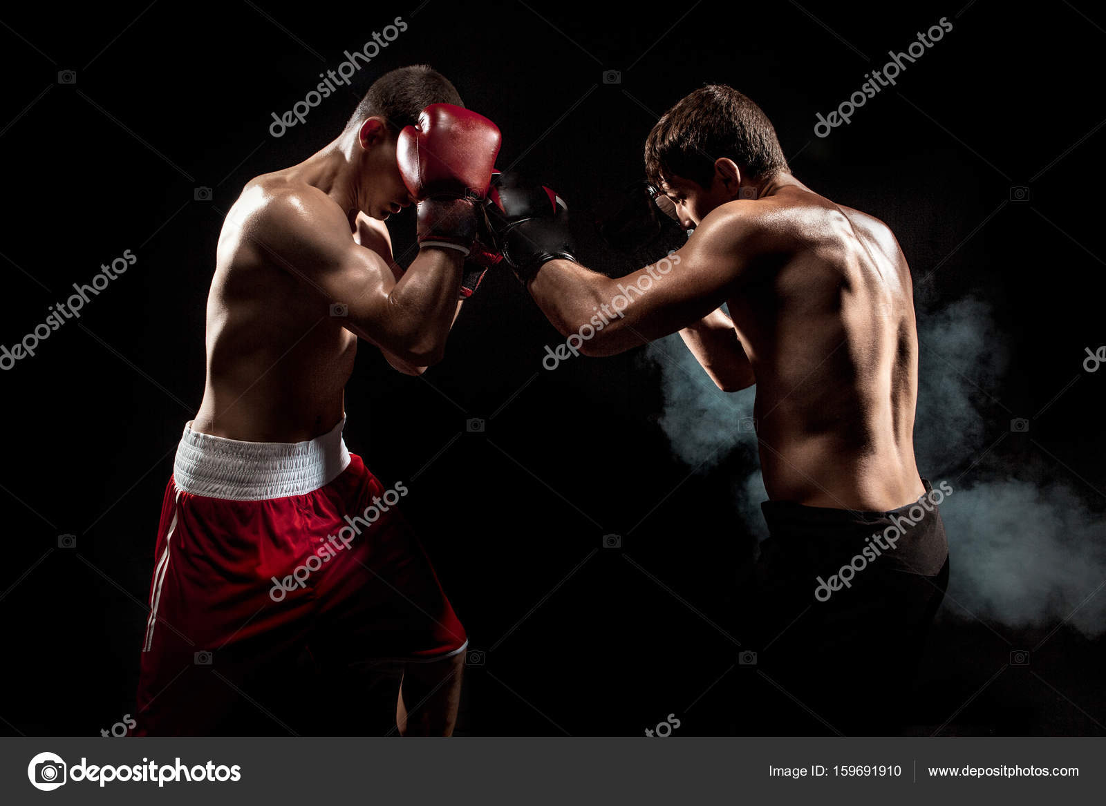 Two professional boxer boxing on black smoky background, Stock Photo by ...