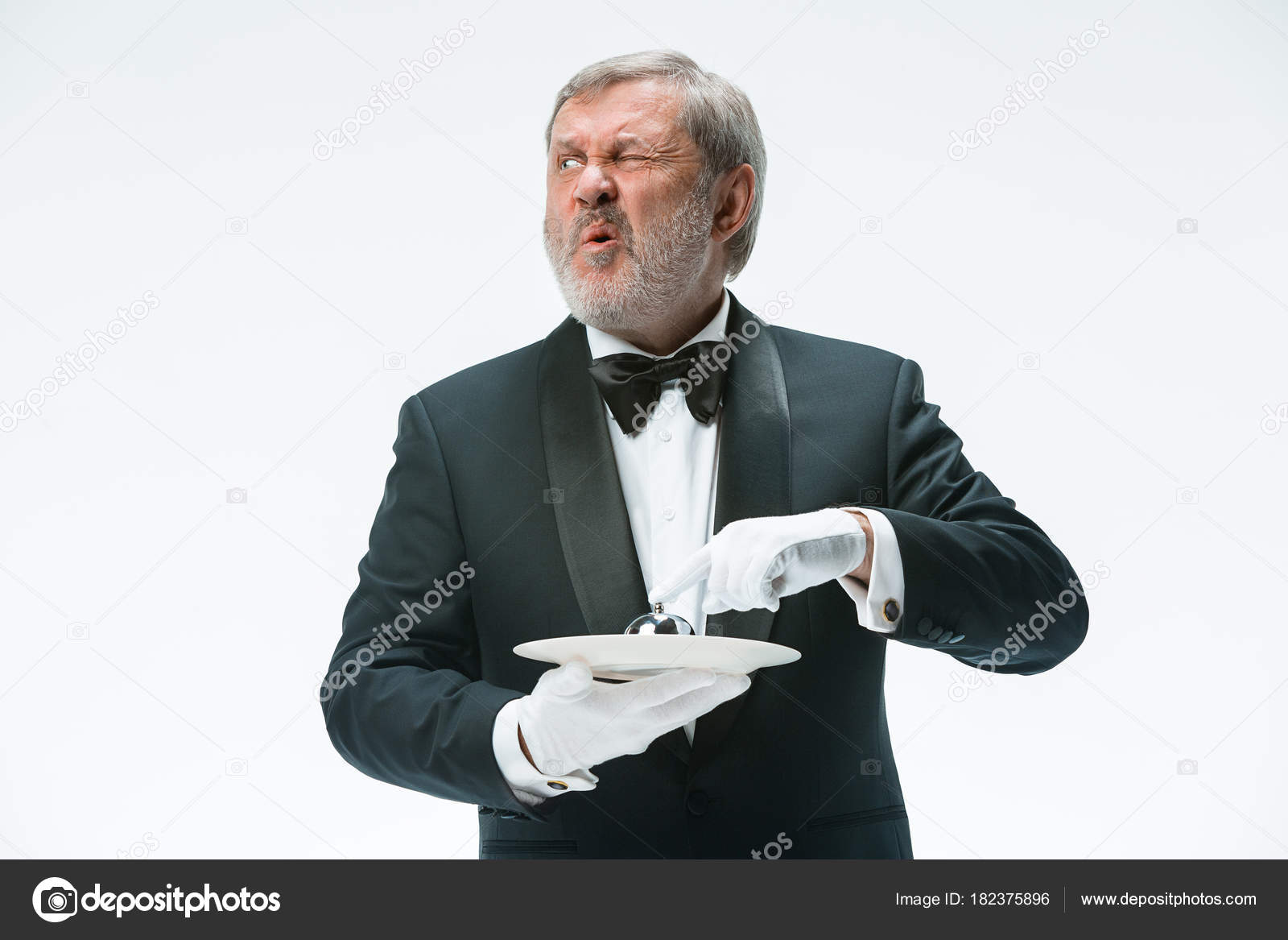Senior waiter holding bell Stock Photo by ©vova130555@gmail.com 182375896