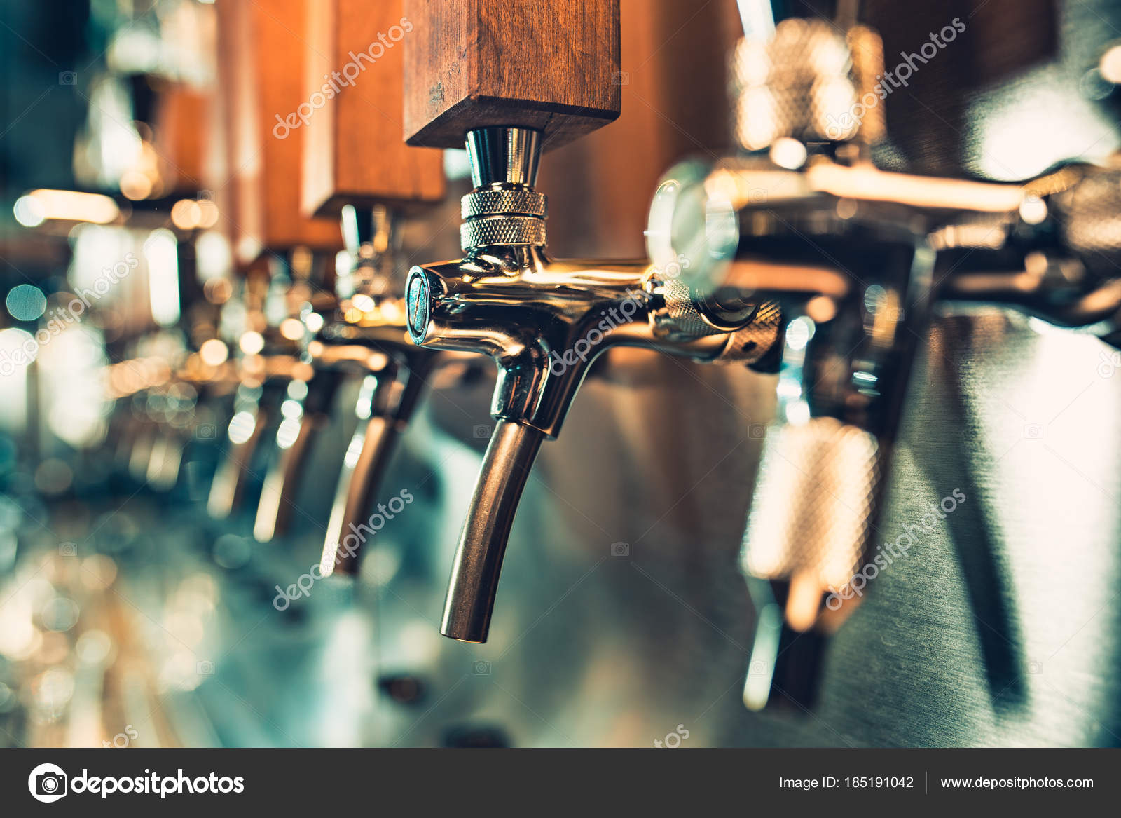 Beer taps in a pub Stock Photo by ©vova130555@gmail.com 185191042