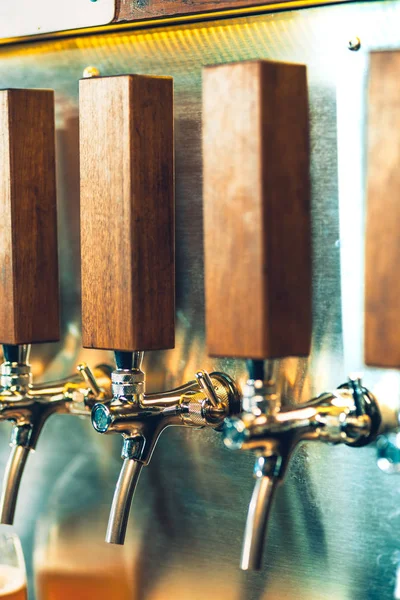 Beer taps in a pub Stock Photo by ©vova130555@gmail.com 185191042