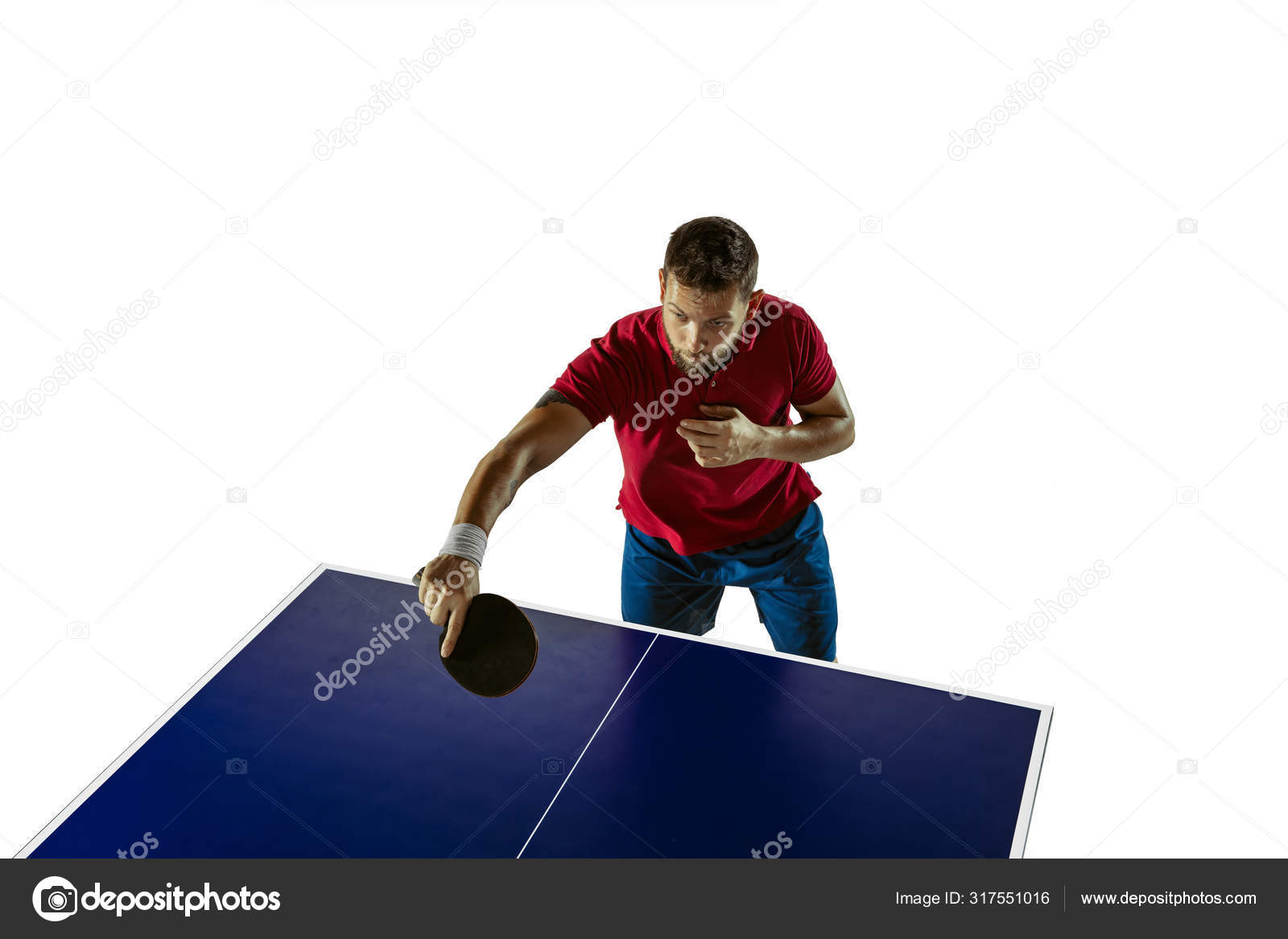 Young man playing table tennis on white studio background — Stock Photo ...