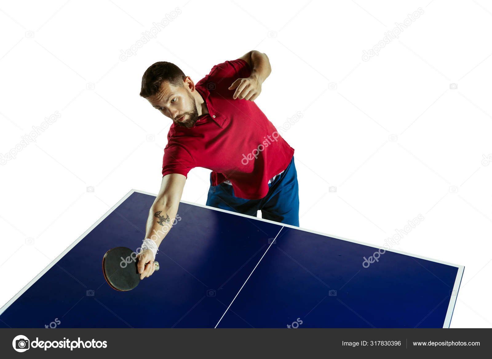 Young man playing table tennis on white studio background — Stock Photo ...