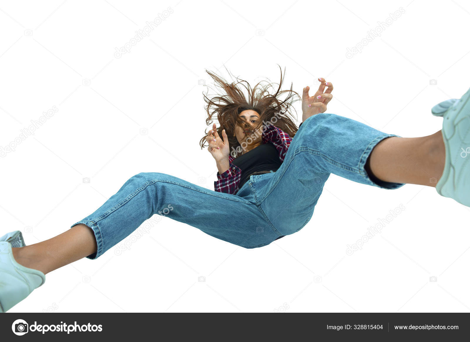 A second before falling - young girl falling down with bright emotions ...