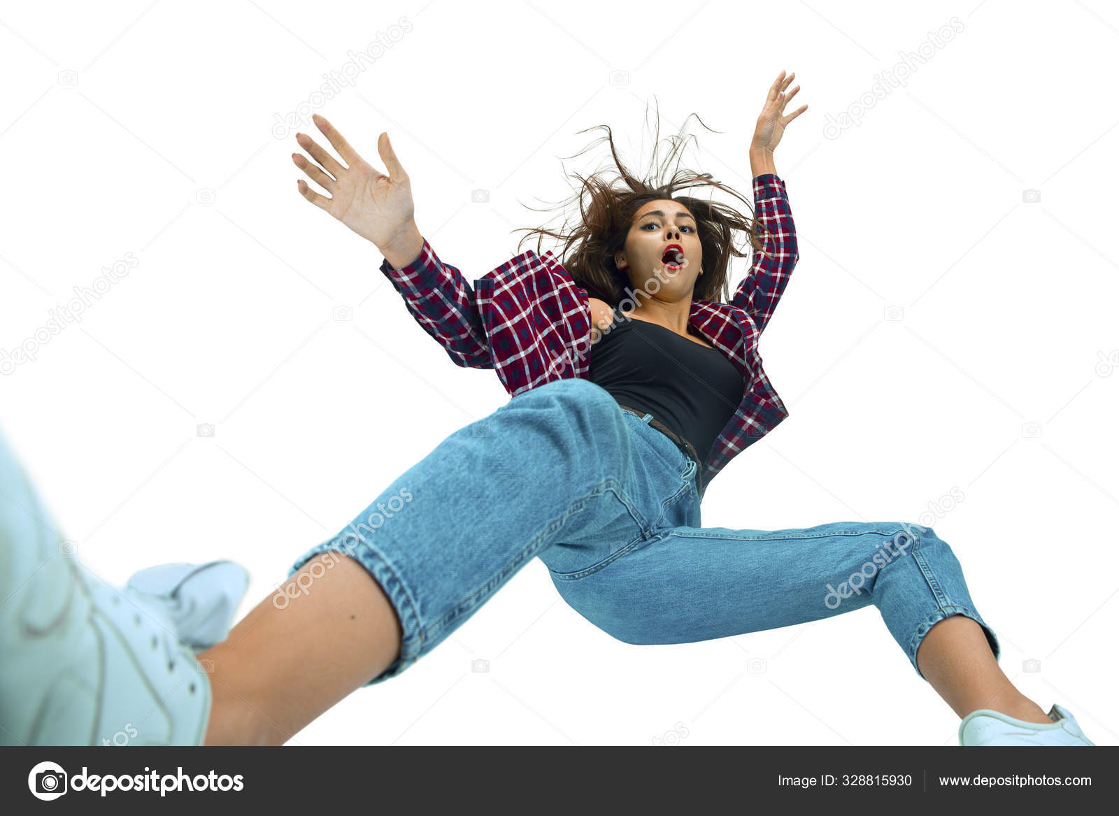 A second before falling - young girl falling down with bright emotions ...